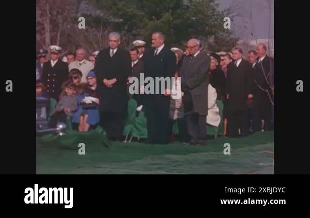 1967 - LBJ looks on at Roger Chaffee's Arlington funeral Stock Video ...
