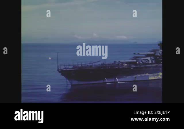 1943 - A pilot readies his float plane on a US Navy aircraft carrier ...