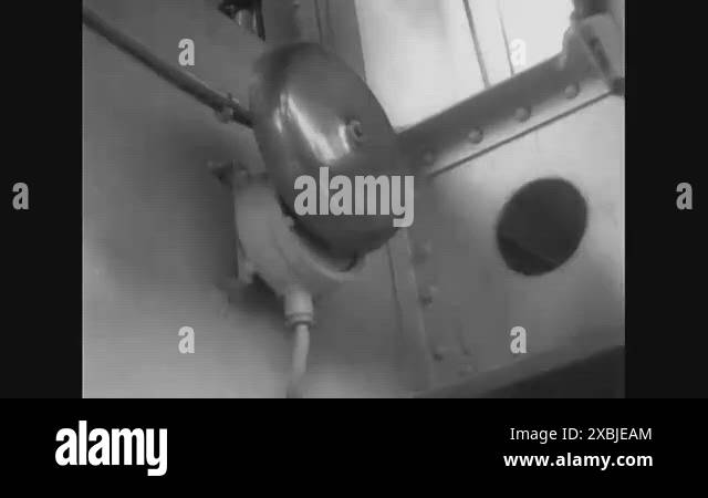 1930s - Gongs on the USS Pennsylvania are shown. The bugler blows taps ...