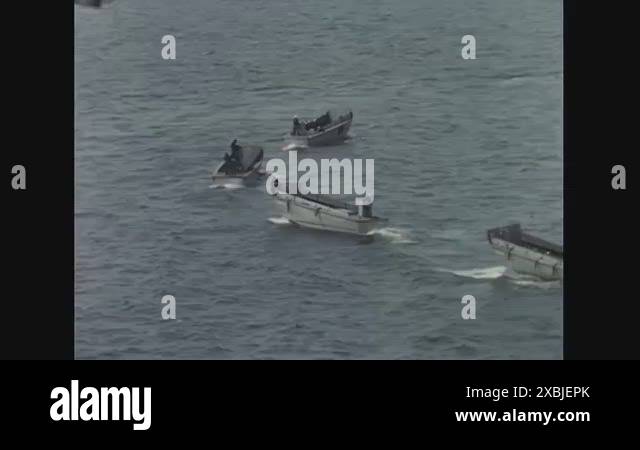Higgins boats begin to form a circle and a Mike Boat is shown during ...