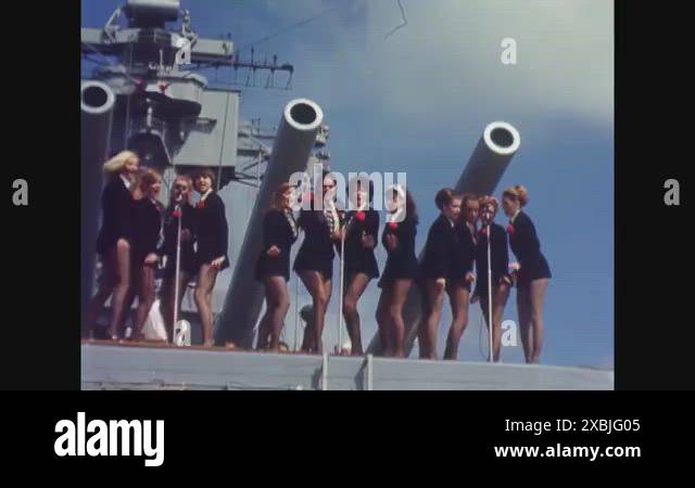 1968 - Seamen on the USS New Jersey take pictures of the Gold Diggers ...