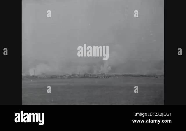 1950 - Smoke columns rise from Hungnam as US Navy vessels approach and ...