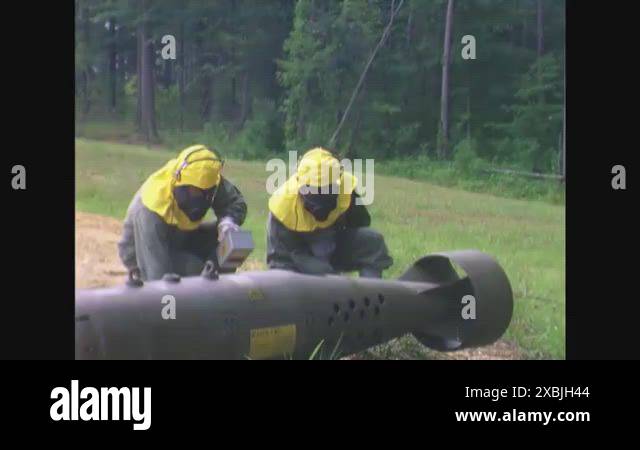 1967 - US Navy EOD officers use Geiger counters on a new type of bomb ...
