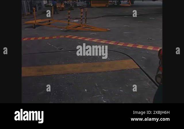 1967 - US Navy seamen wheel Snakeye bombs towards an aircraft on the ...