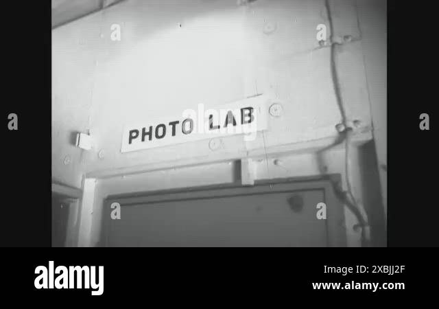 1952 - US Navy seamen are seen at work in the photo lab aboard the USS ...