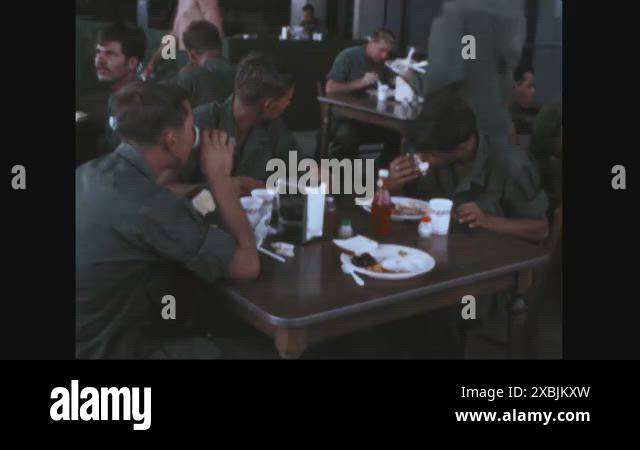1969 - American soldiers are served and eat in a mess hall in Vietnam ...