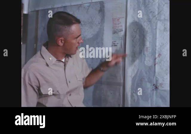 1966 - A briefing officer uses a pointer while going over a map with ...