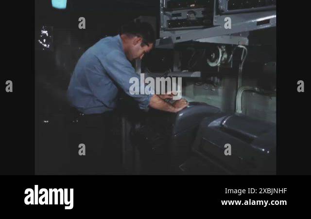 1966 - A radioman in the US Marines works with a teletype machine on the USS Iwo Jima Stock ...