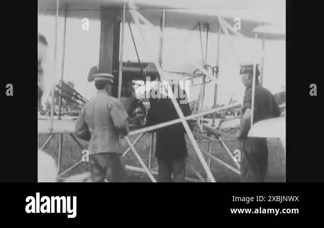 1920s - US Navy mechanics work on the engine of a biplane Stock Video ...