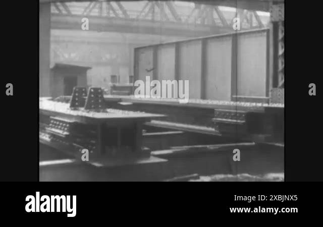 Columns are shown and steel erectors are used to set steel billets in ...