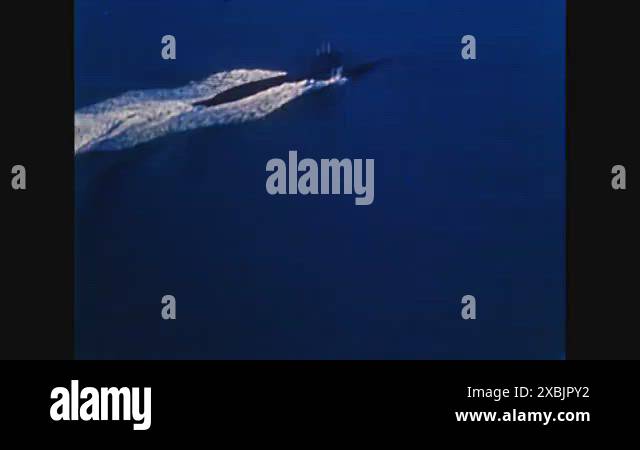 1964 - An aerial view shows a US Navy nuclear submarine breaching Stock ...