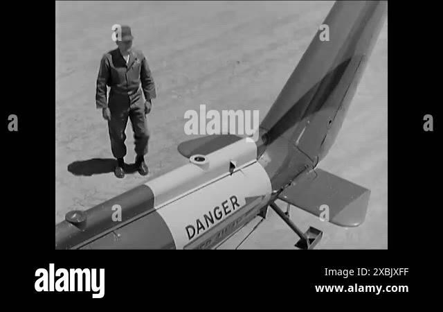 1956 - Pre-flight inspection along the left side and underneath an Army ...