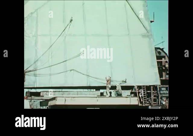 1940s - The forward facade of a ship is delivered to its assembly site ...