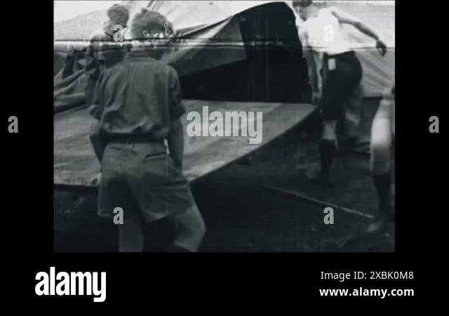 1937 - German boys build and install a wooden platform and wall at a ...