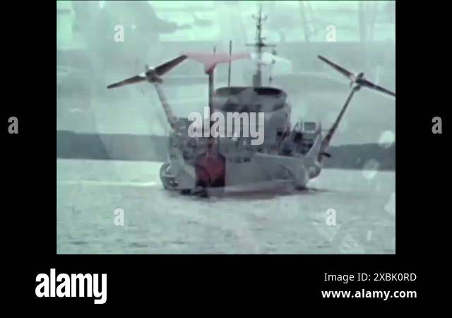 1970s - A boat operator uses a control panel in hydrofoil boat in a ...