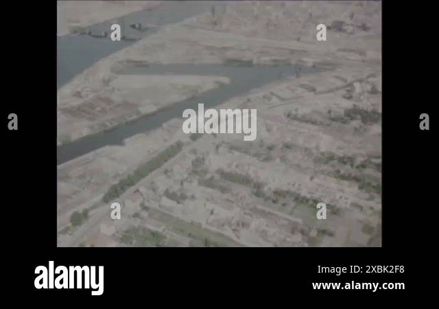 1945 - Ruined buildings are shown as well as a river with collapsed ...