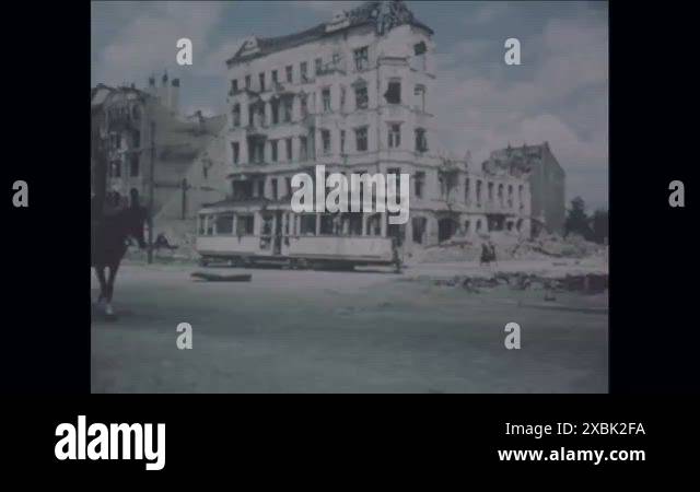 1945 - A wrecked streetcar and destroyed buildings are shown as well as ...