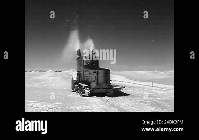 1961 - A Peter Plow snow milling machine is used to dig trenches for a ...