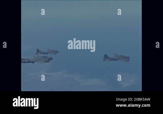 1943 - Footage shot from a B-17 shows other planes overhead and the ...