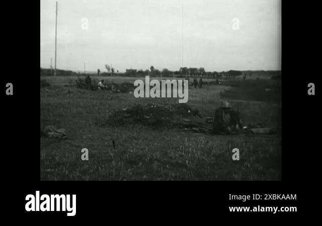 1918 - A soldier shaves in a foxhole and soldiers play cards, write ...