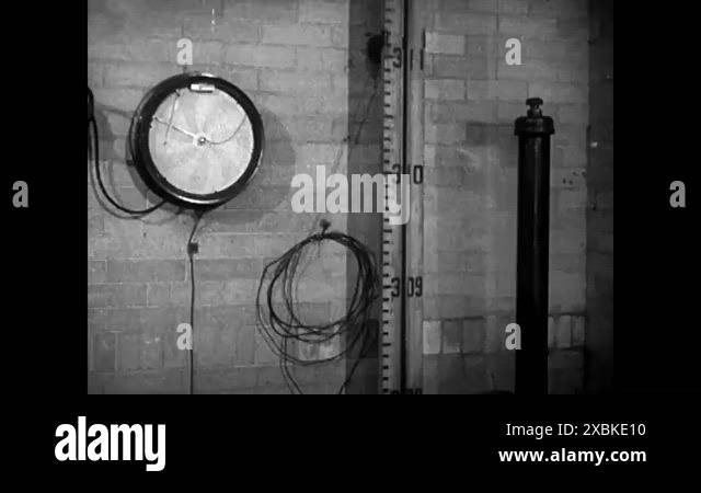 A meter is checked and a telephone is answered and pump is activated at ...