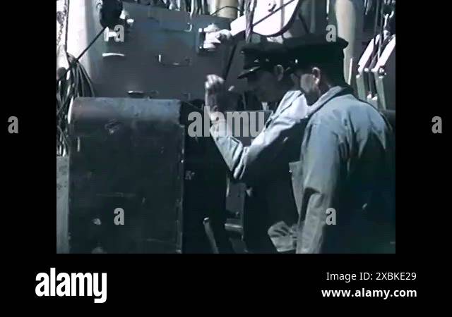 Customs inspectors searching for smugglers and contraband examine a ...