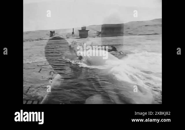 Members of an underwater demolition team scuba dive and crewmen roll ...