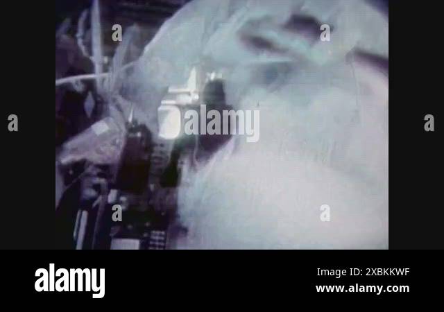 Astronaut John Watts Young and Robert Laurel Crippen float in zero gravity with com lines in the ...