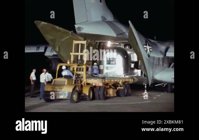 1969 - Spectators crowd a USAF plane carrying the Apollo 11 crew after ...