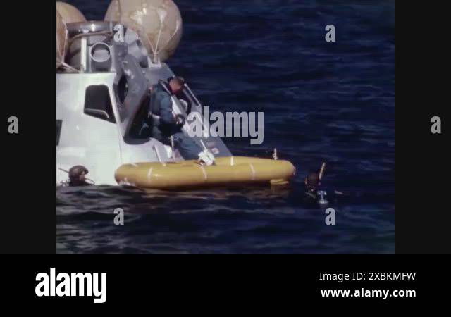 1969 - After their water landing, the crew of Apollo 11 gets into a ...