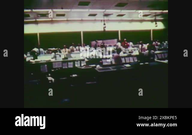 Flight controllers in the Mission Control Center monitor the undocking ...