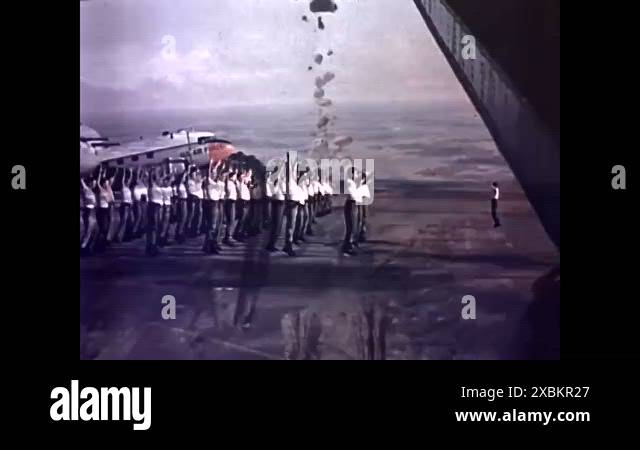 General Paul Donal Harkins speaks and air commandos do jumping jacks ...