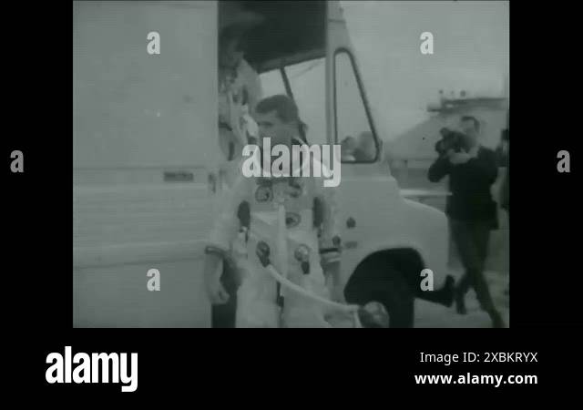 Astronauts Gus Grissom, Edward White and Roger Chaffee exit a van and ...