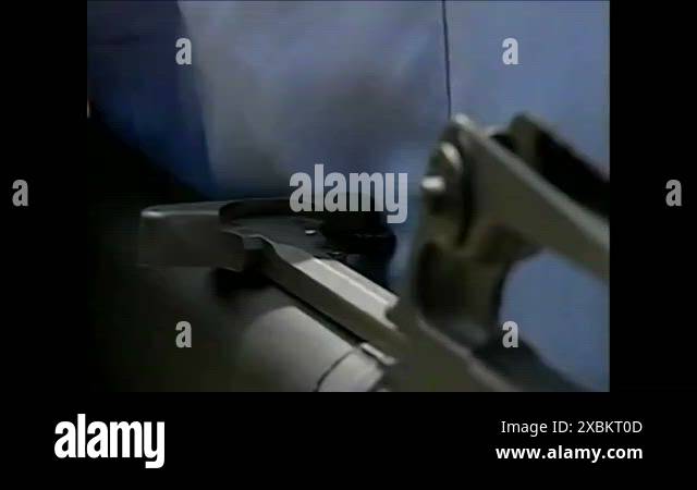 A line instructor demonstrates chambering and a student is instructed ...