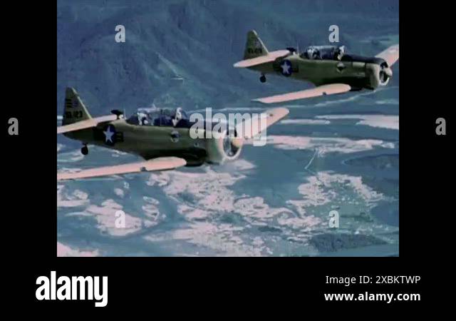 Vietnamese air force fighters are shown in flight and paratroopers bail ...