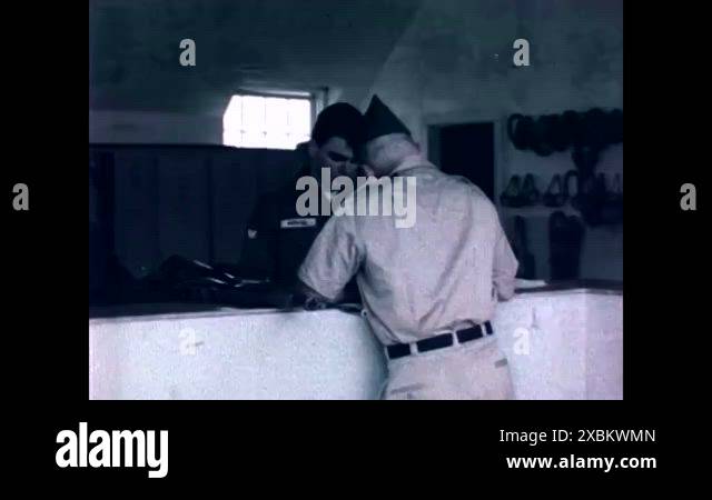 M14 rifles are distributed, cleaned and assembled and a drill ...