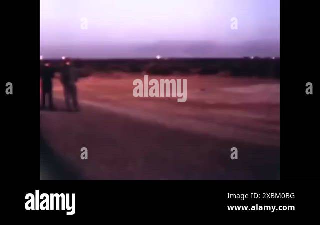 A Little Joe II rocket is launched and a capsule is ejected at White ...