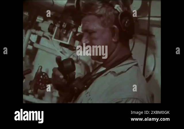 1970 - A rescue chamber from a US Navy ASR is lowered onto a submarine ...