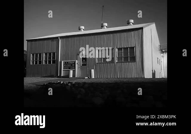 A plotter at a United States Army experimentation control center moves ...