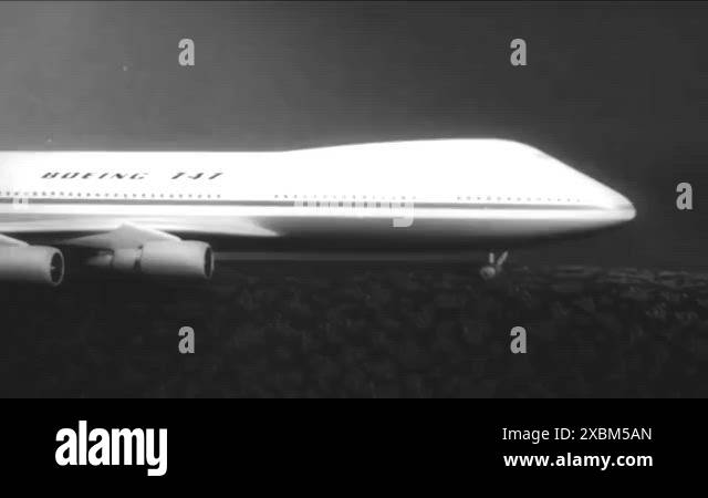 Scale models are shown as well as stewardesses and a flight crew and ...