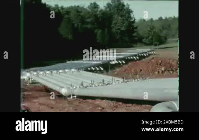 Discharge tubes and a movie camera are used with a static test stand ...