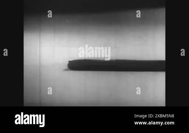 1937 - A fuse is lit and an animation shows nerve impulses and an iron ...