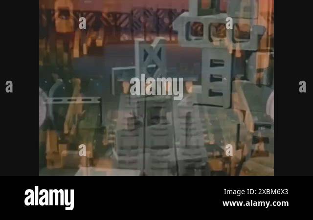 1961 - A presenter talks about ornamental concrete blocks on a stage ...