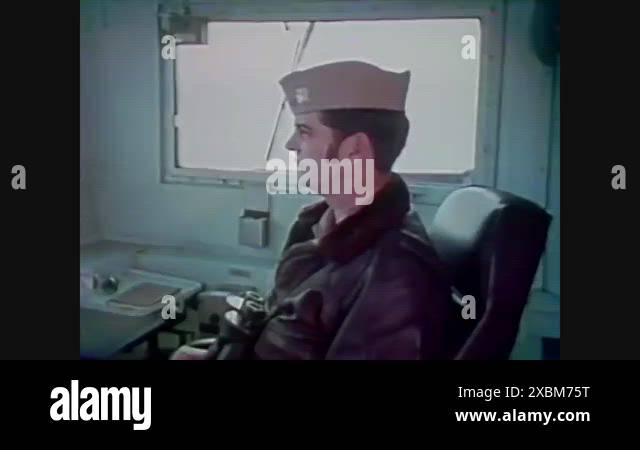 1975 - Sailors aboard a US Navy ship are called to their battle ...