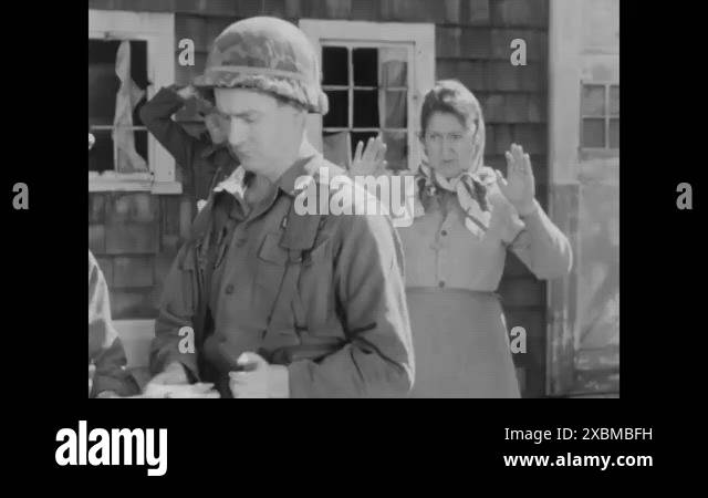 1963 - A US Army sergeant instructs one of his soldiers to be strict ...