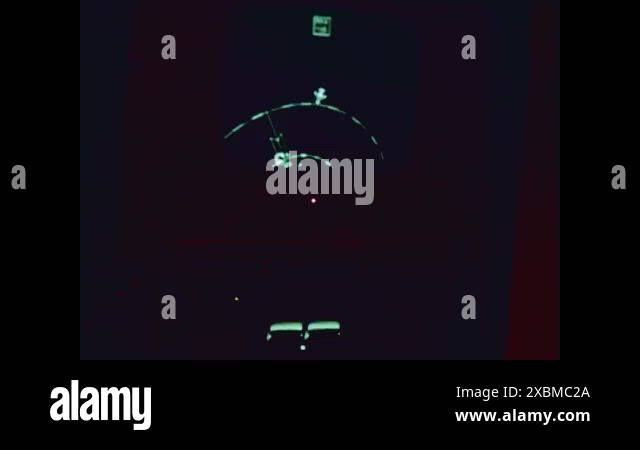 1978 - An researcher at a monitoring console watches aircraft displayed ...