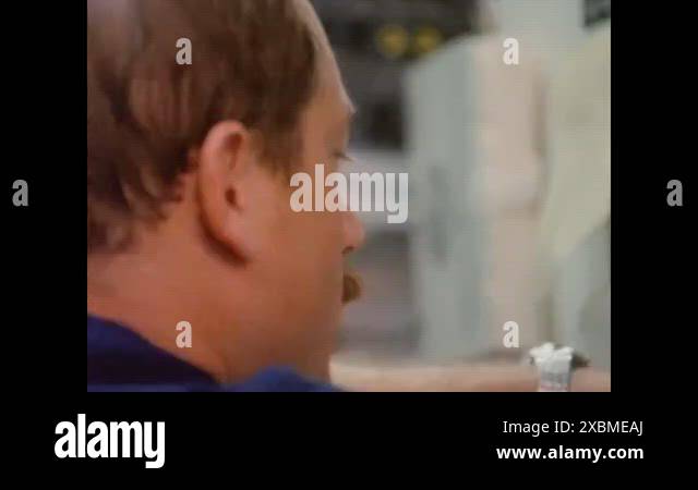 1984 - Astronauts prepare food on board the Space Shuttle Discovery STS ...