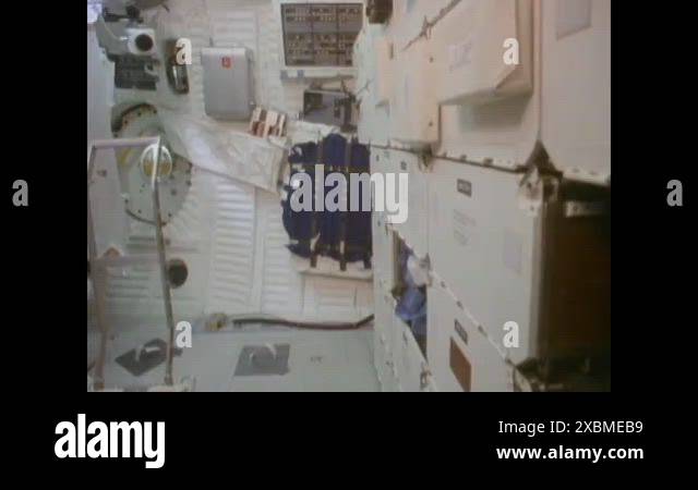 1984 - An astronaut pulls one of his fellows out from inside a locker ...