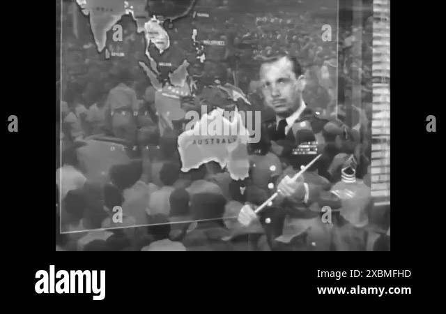 1958 - Army Master Sergeant Stuart Queen points to a map and talks ...