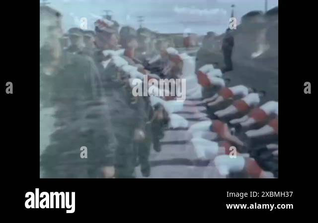 1966 - Recruits compete in a tug of war and lift weights and do sit-ups ...